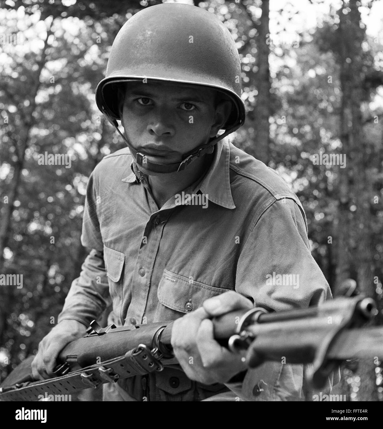 WORLD WAR II: SERGEANT, 1942. /nSergeant George Camblair learning to ...