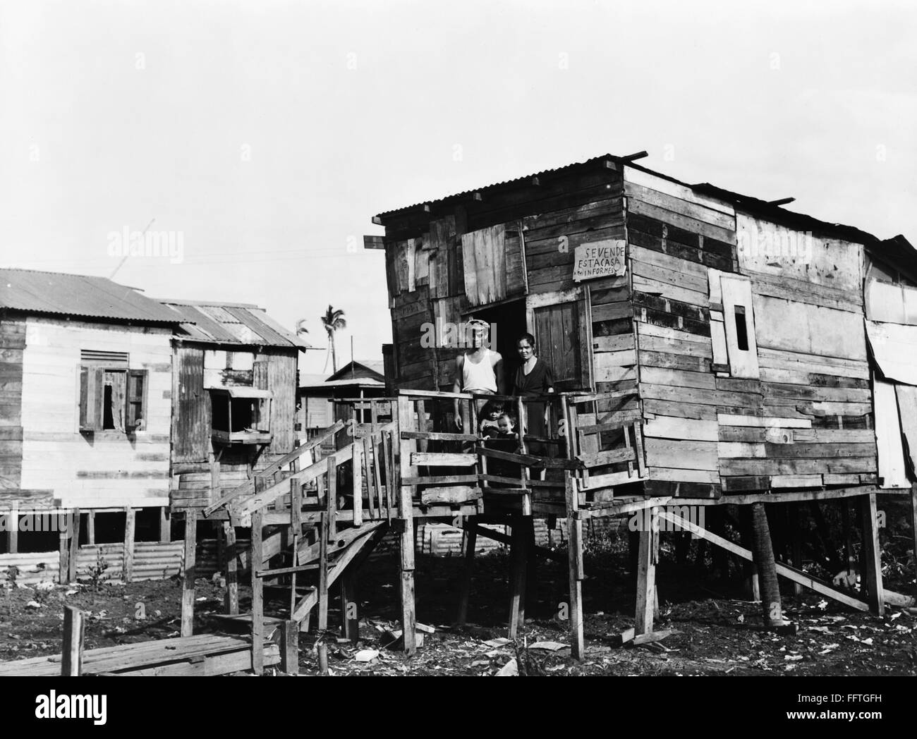 PUERTO RICO: SLUM, 1941. /nA family standing in front of their ...