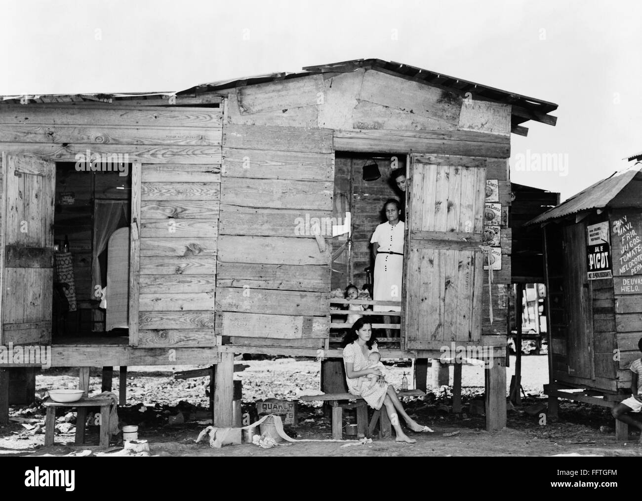 PUERTO RICO: SLUM, 1941. /nA family standing in the doorway of their ...