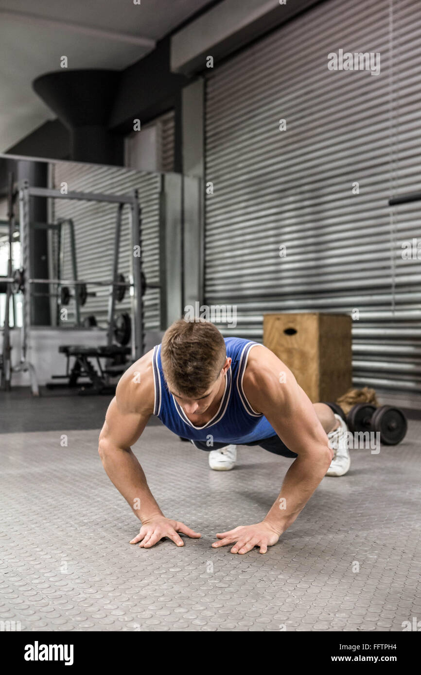 Muscular man doing push up Stock Photo - Alamy