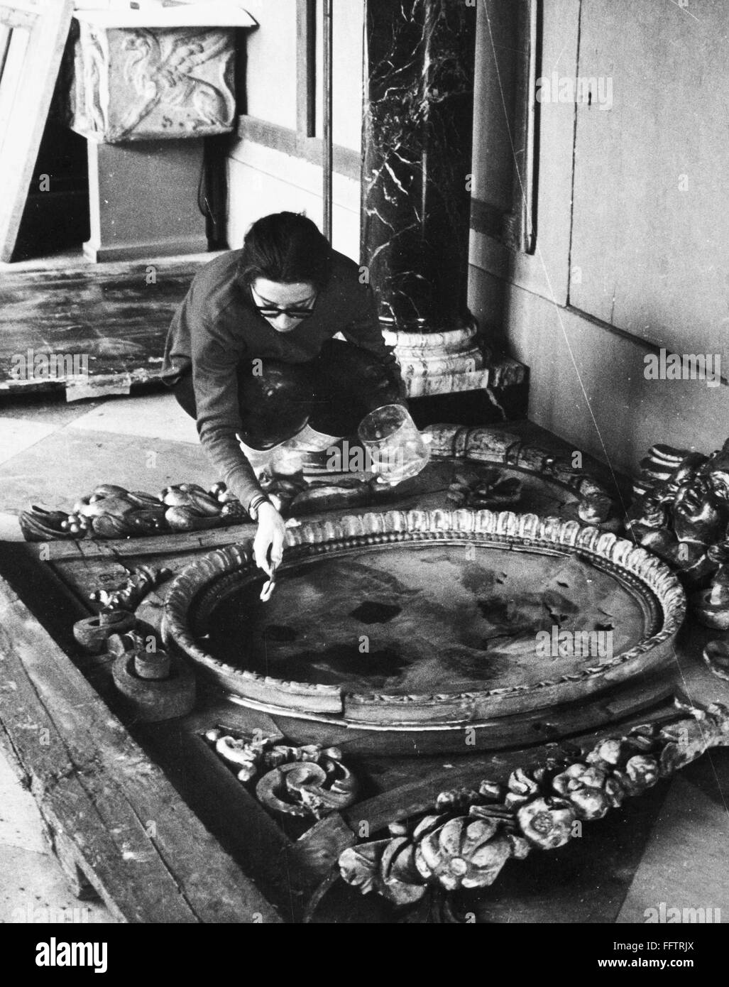FLORENCE: FLOOD, 1966. /nA woman cleans a painting at the Uffizi ...