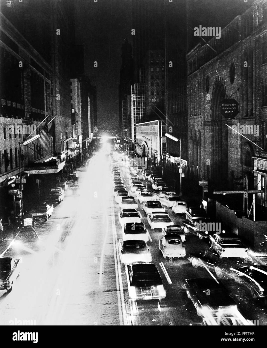 NEW YORK: BLACKOUT, 1965. /nEast 42nd Street lit only by the headlights ...