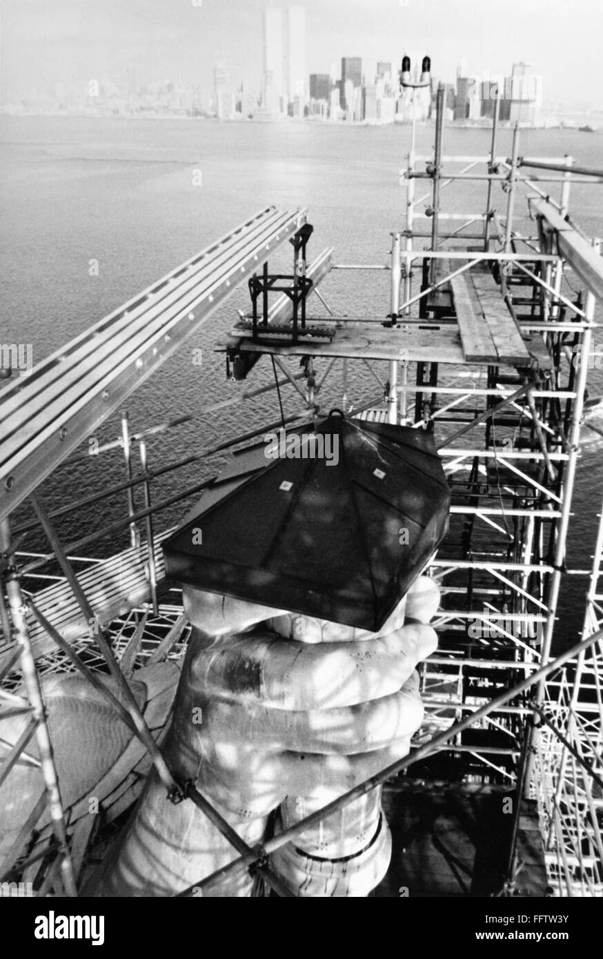 STATUE OF LIBERTY, 1986. /nA metal cap has replaced the torch while the ...