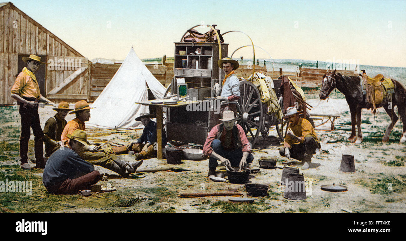 COWBOY CAMP, c1900. /nCowboys seated around a chuckwagon at a campsite ...
