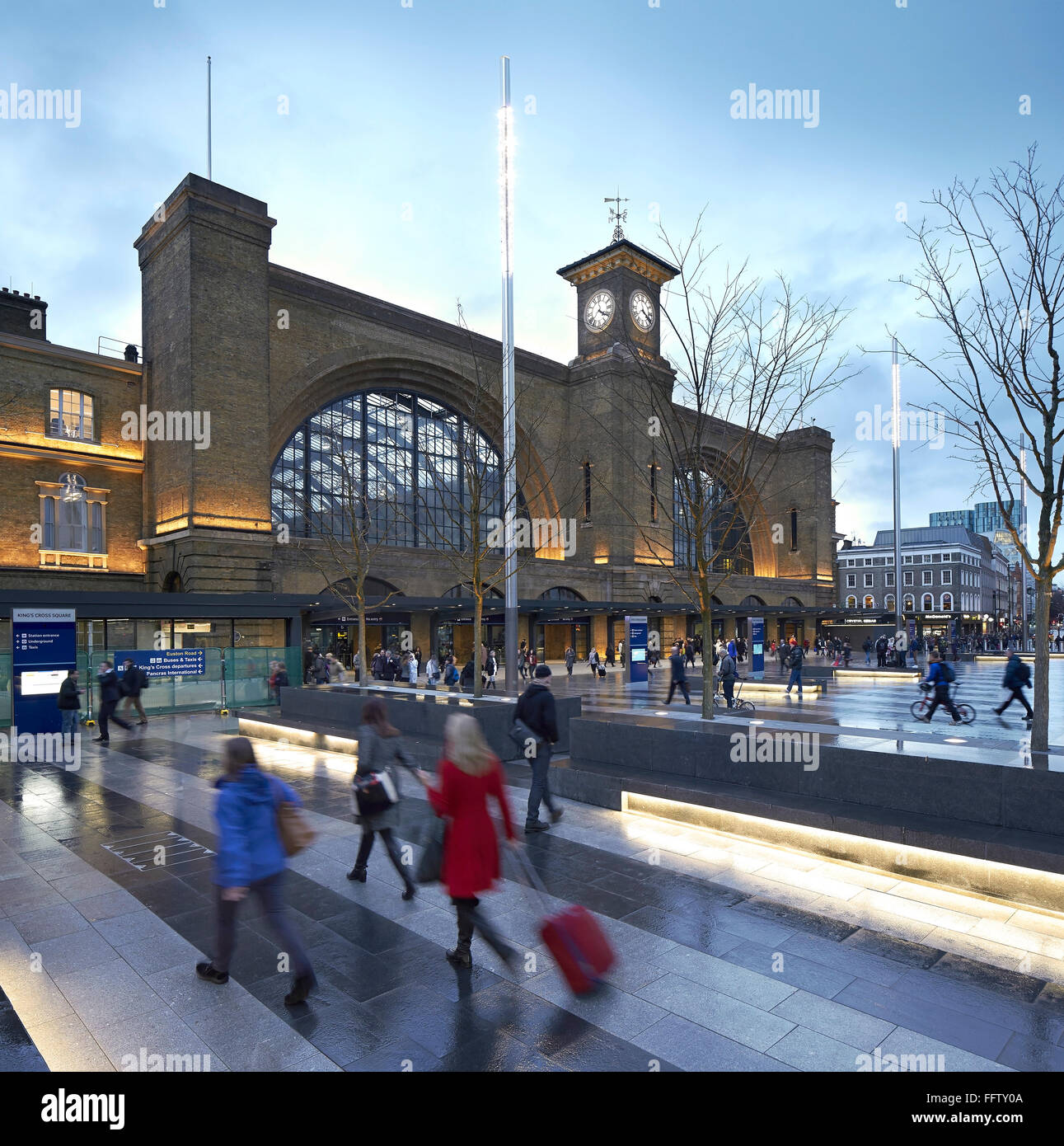 Dusk elevation across square towards station. King's Cross Square ...