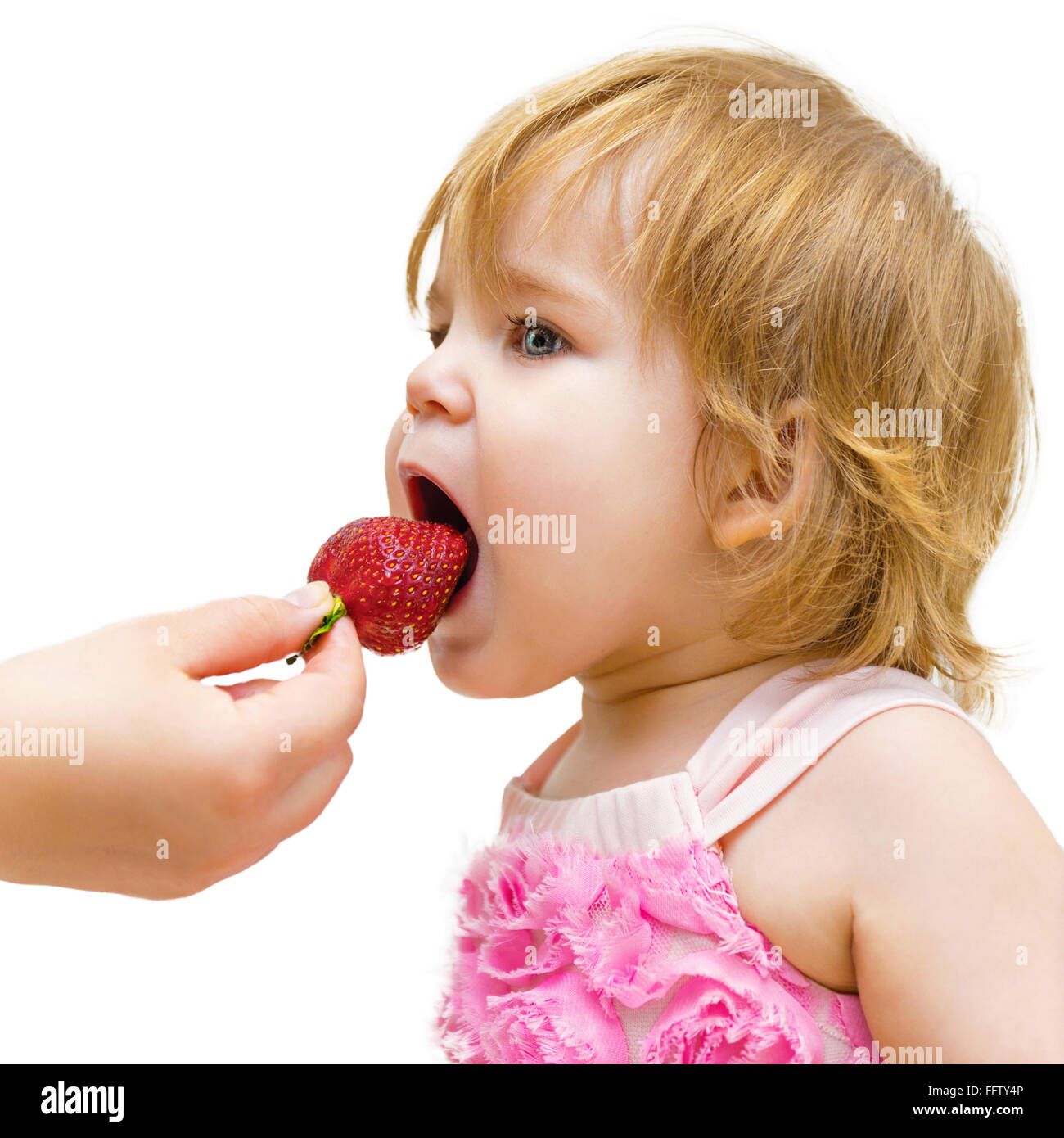 Portrait of a beautiful little girl with strawberry Stock Photo - Alamy