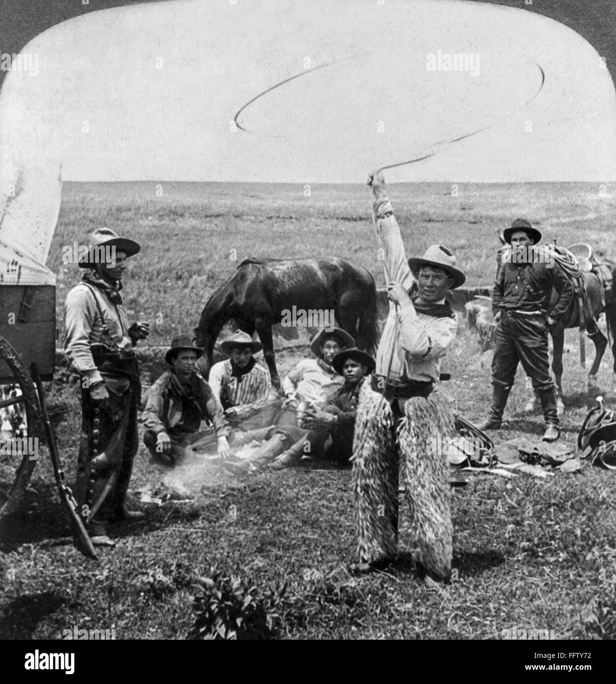 OKLAHOMA: COWBOYS, c1905. /nA cowboy twirling a lariat in the air as ...