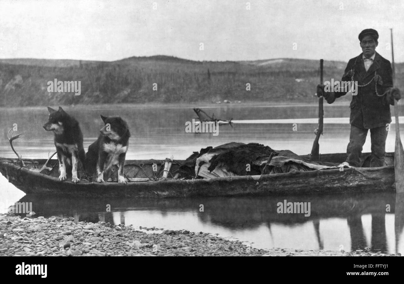 ALASKA: TRAPPER. /nAn Inuit tapper with hides and dogs in a canoe in ...