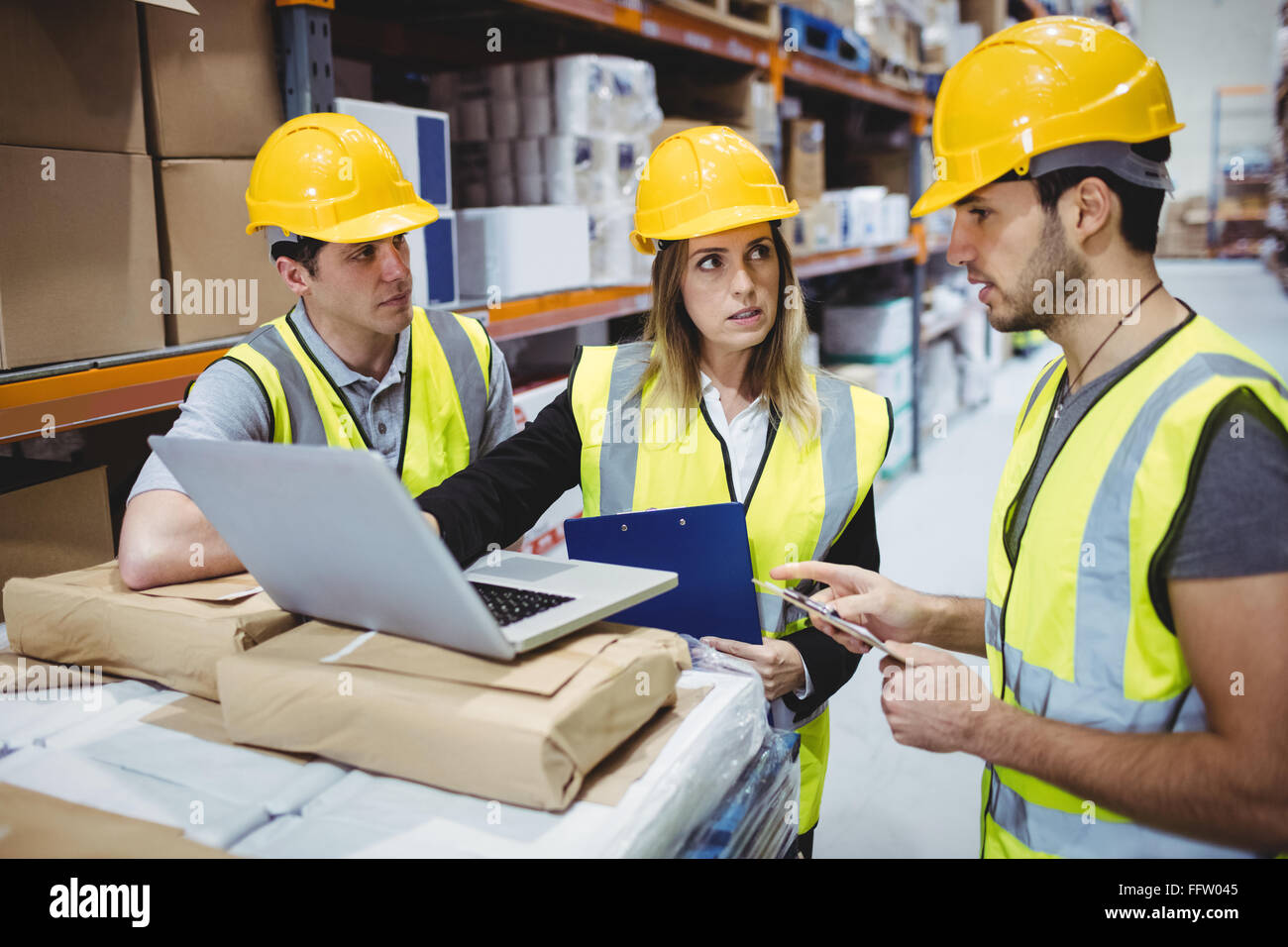 Portrait of smiling warehouse managers Stock Photo - Alamy