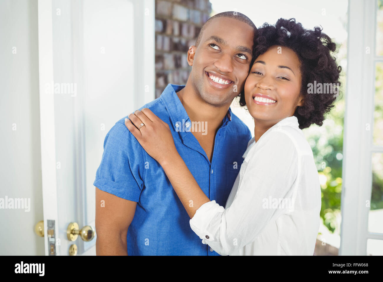 Happy couple embracing Stock Photo - Alamy