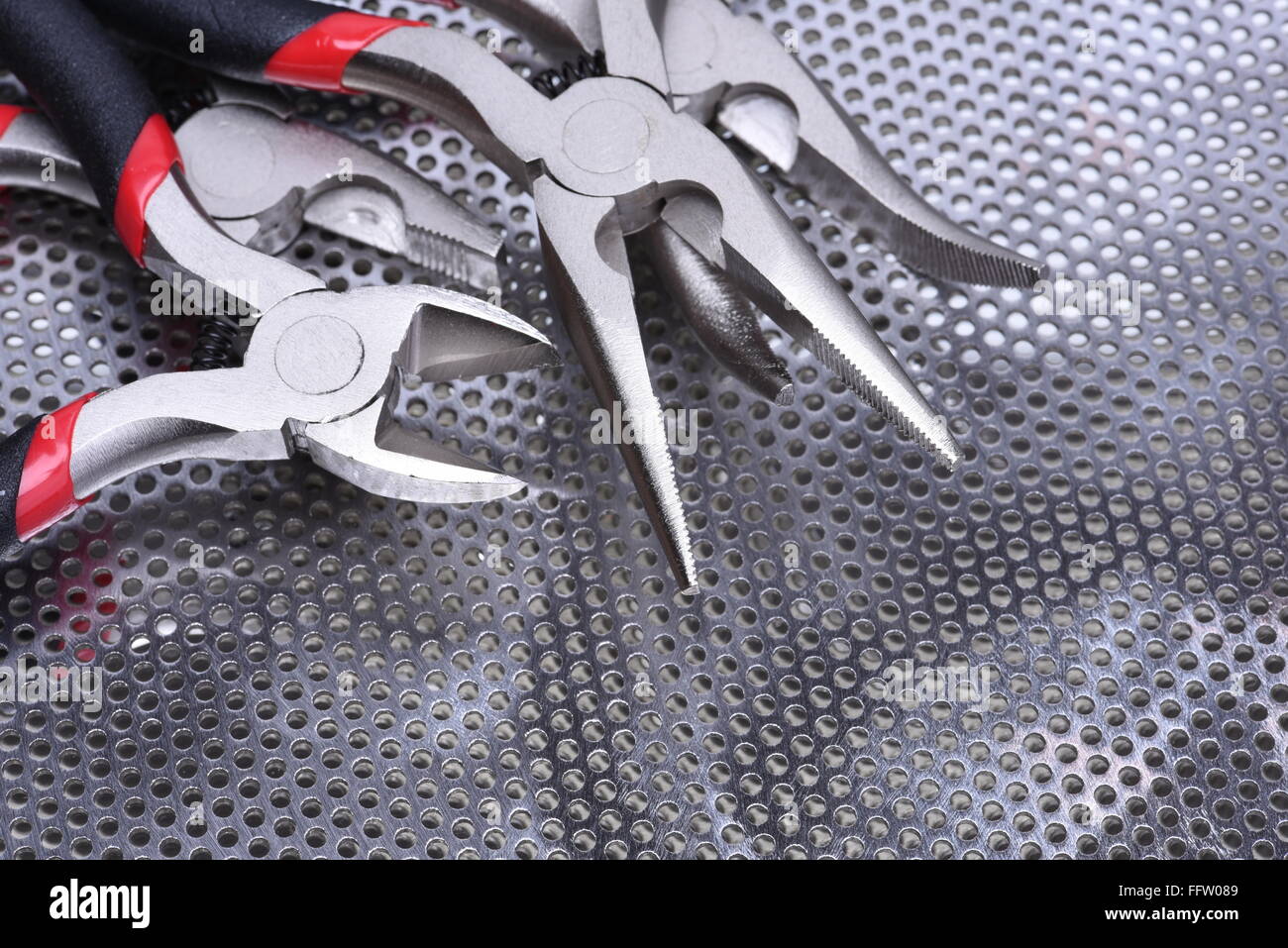 Electrical tools wire cutter, pliers on metal background Stock Photo ...
