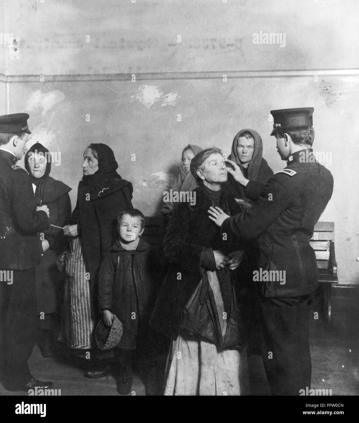 ELLIS ISLAND: INSPECTION. /nFederal inspectors examining the eyes of ...