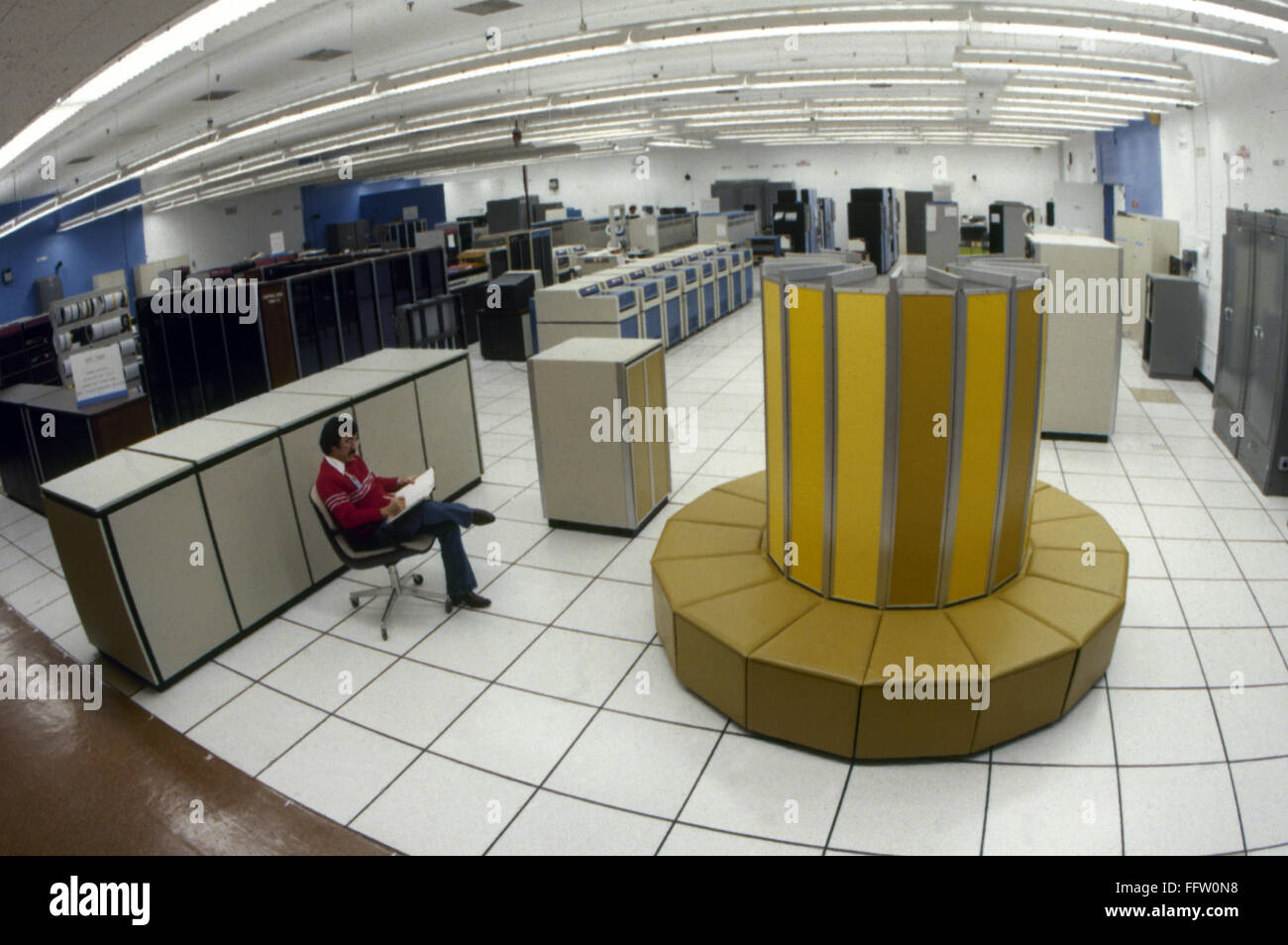 COMPUTER ROOM, c1982. /nCray-1 supercomputer (foreground) in a computer ...