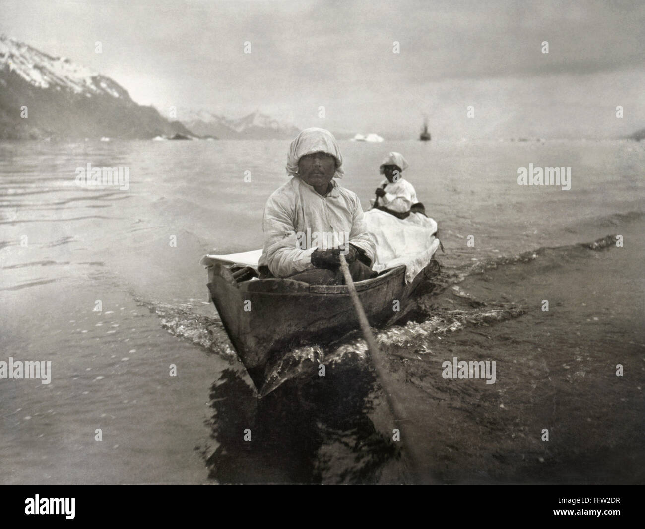 SEAL HUNTERS, c1899. /nTwo Inuit seal hunters in a canoe on the Glacier ...