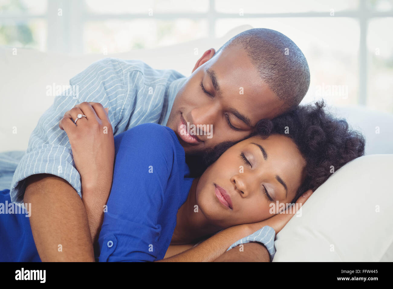 Peaceful couple sleeping on the sofa Stock Photo - Alamy