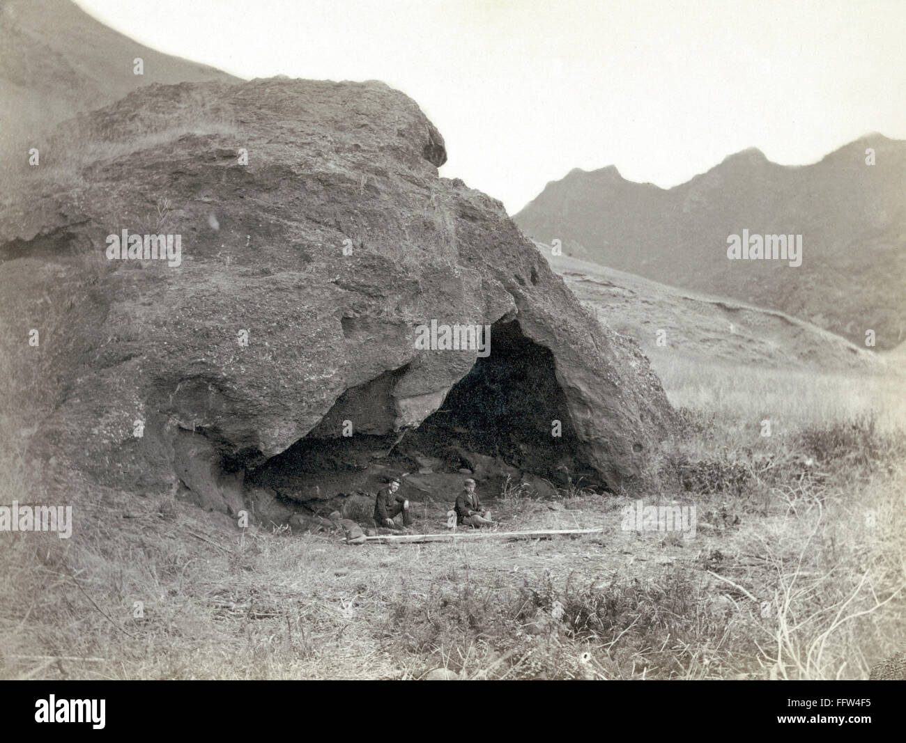 ALEXANDER SELKIRK CAVE. /nTwo men outside the cave that Scottish sailor ...