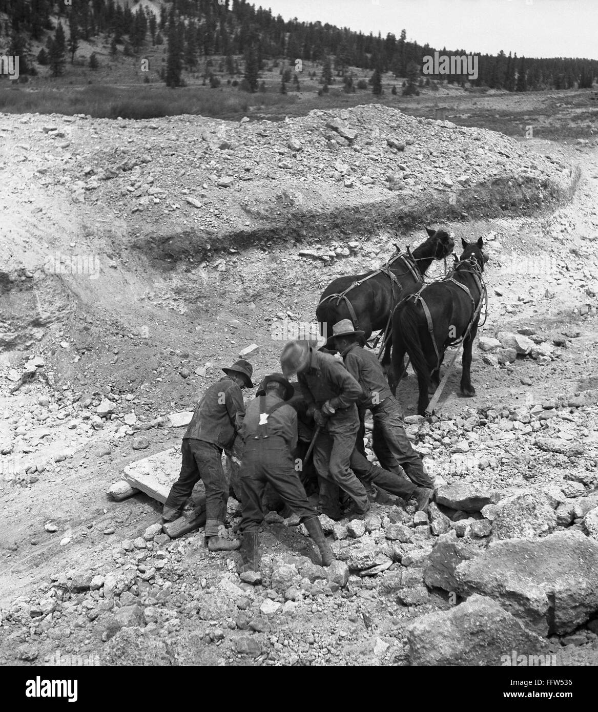 UTAH: DAM CONSTRUCTION. /nWorkers load boulders onto a cart, excavating ...