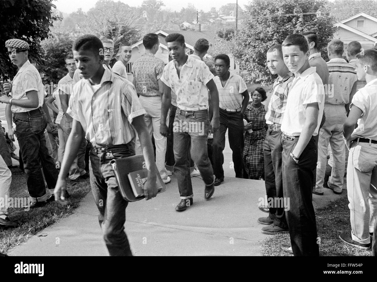 SCHOOL DESEGREGATION, 1956. /nBlack students walking through a crowd of ...