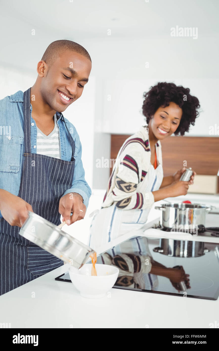 Happy couple cooking together Stock Photo - Alamy
