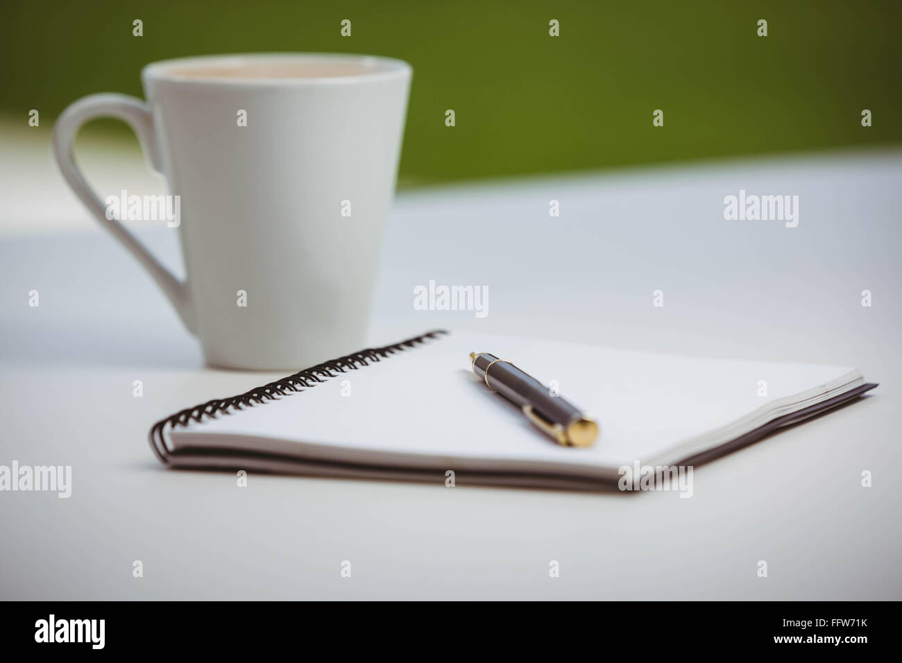 Overhead of notebook with pen and coffee Stock Photo - Alamy