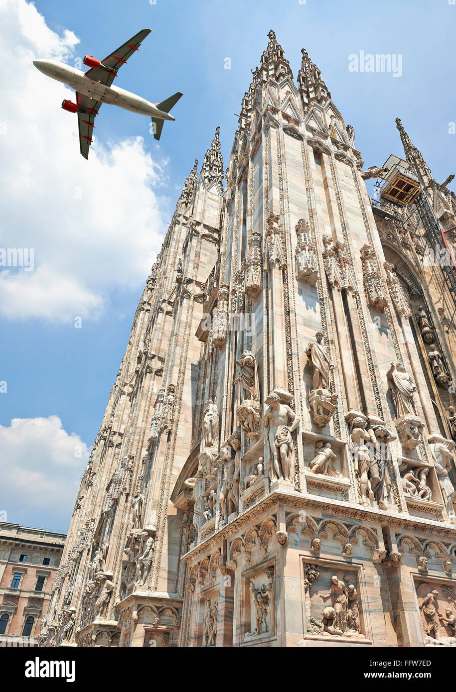 A jet plane flying low over the Milan Cathedral, Italy Stock Photo - Alamy