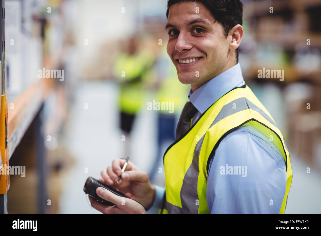 Male warehouse worker using scanner hi-res stock photography and images ...