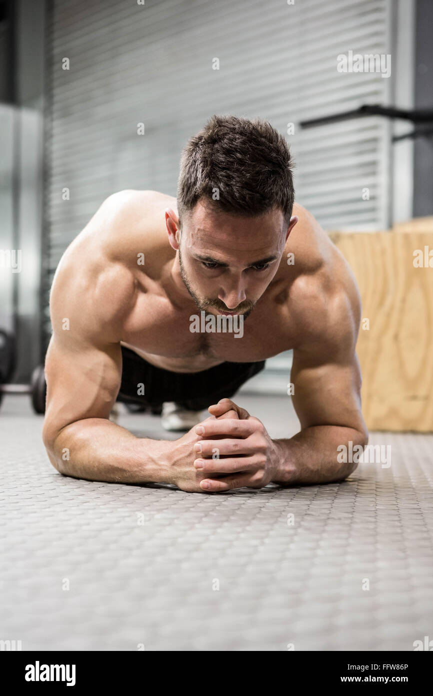 Shirtless man planking Stock Photo - Alamy