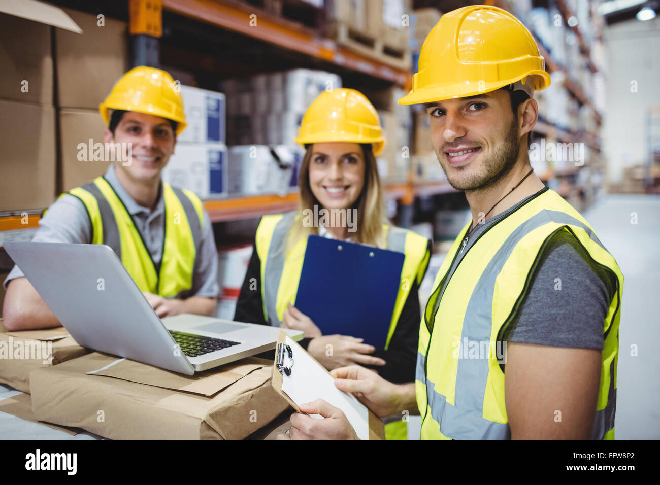 Portrait of smiling warehouse managers Stock Photo - Alamy