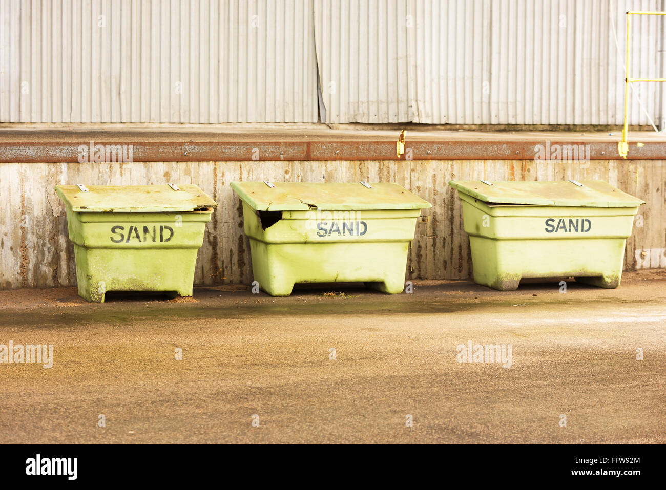 Three sand crates outside an industrial building Stock Photo - Alamy