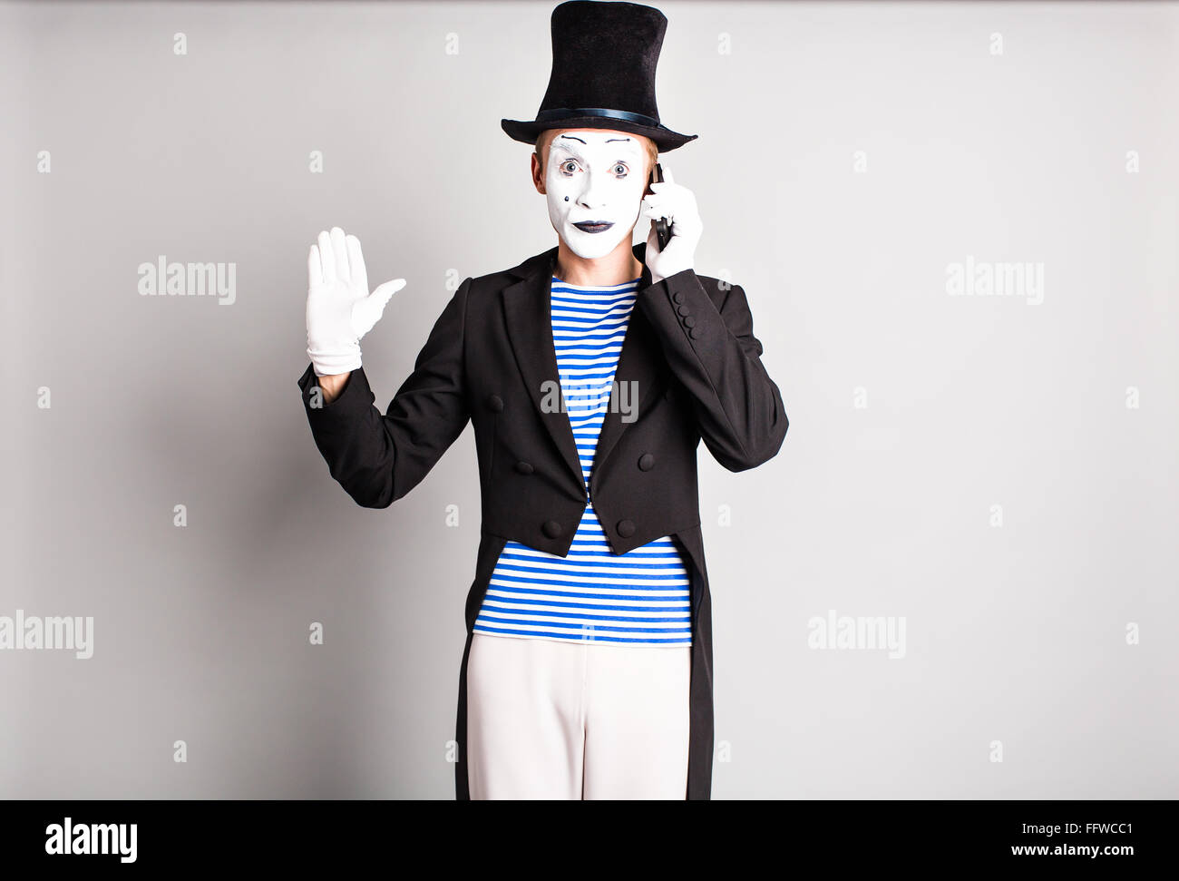 mime with smartphone. Concept of April Fools Day Stock Photo - Alamy