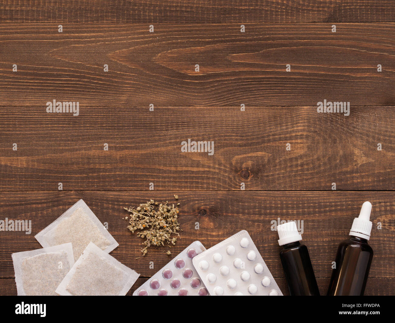 tablets, drops and herbals on a dark wooden background Stock Photo - Alamy