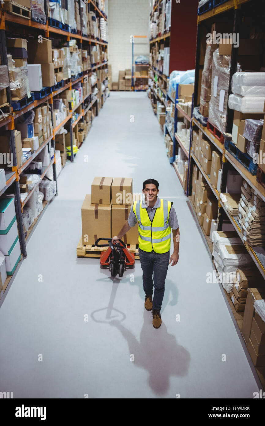 Warehouse pulling pallet truck boxes hi-res stock photography and ...