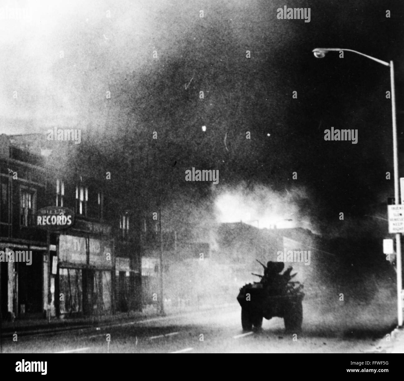 DETROIT RIOTS, 1967. /nAn army vehicle patrols 12th Street in Detroit ...