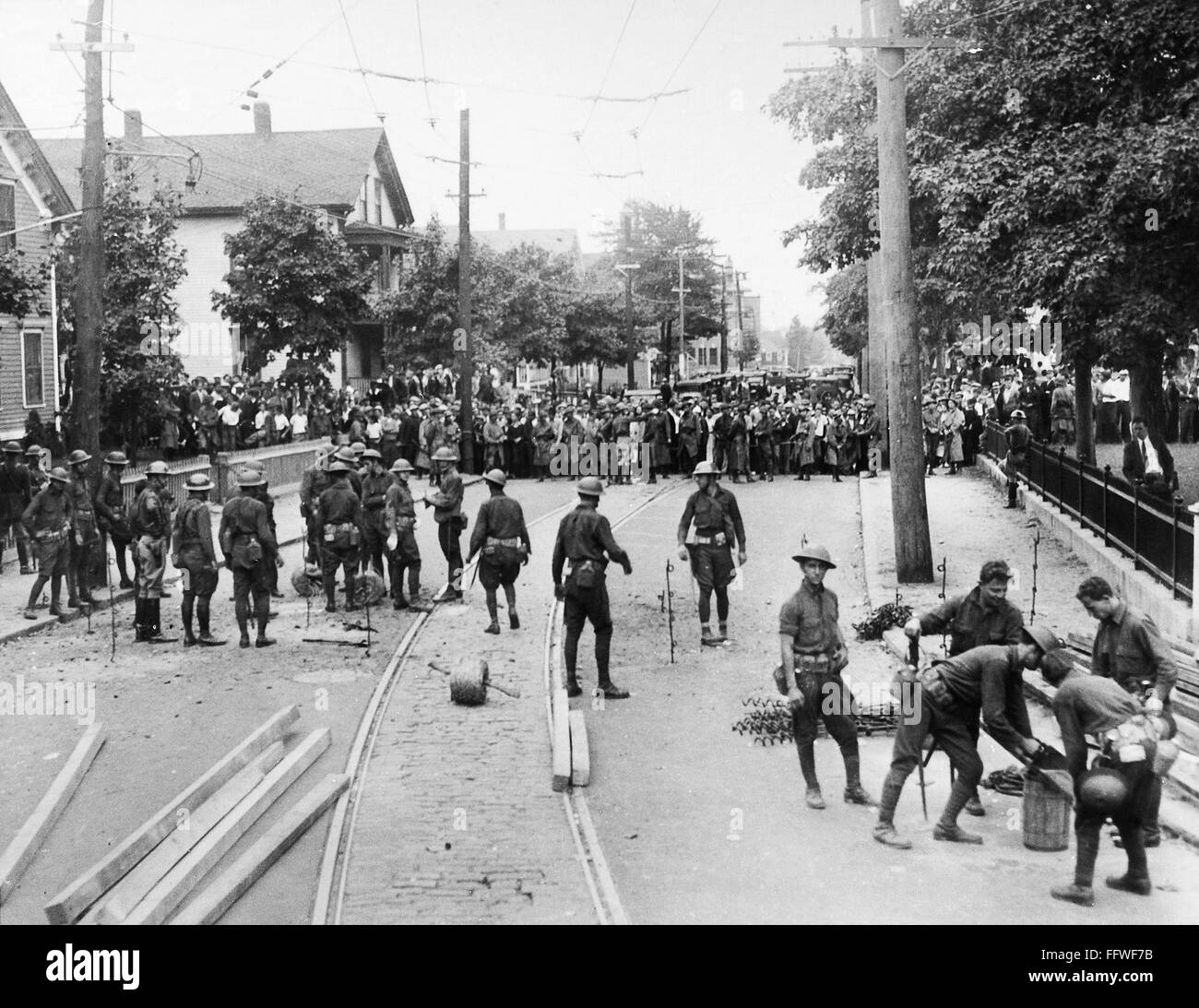 TEXTILE STRIKE, 1934. /nState troopers erecting barbed wire fences ...