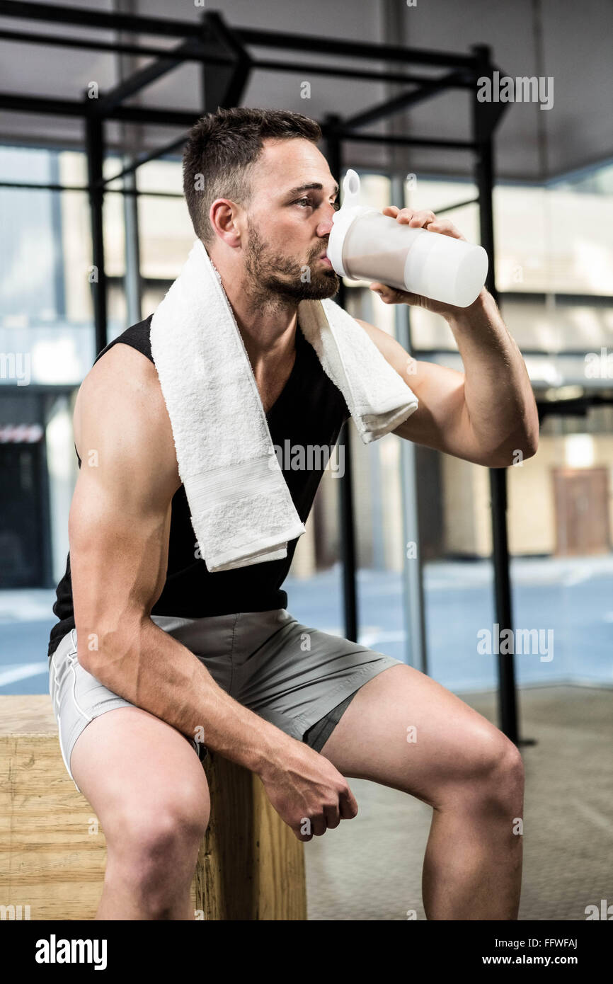 Muscular man drinking protein shake Stock Photo - Alamy