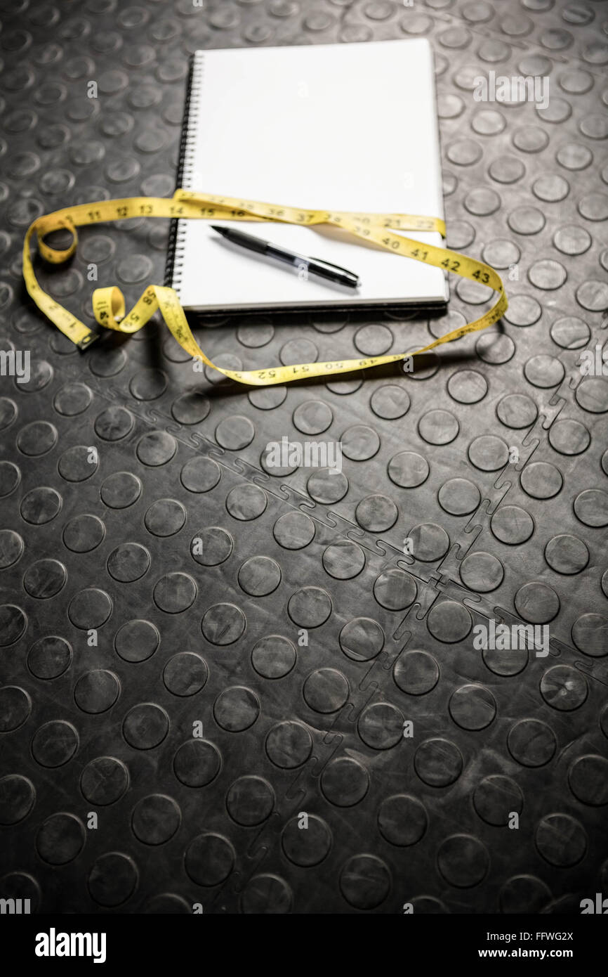 Notepad and measuring tape Stock Photo - Alamy