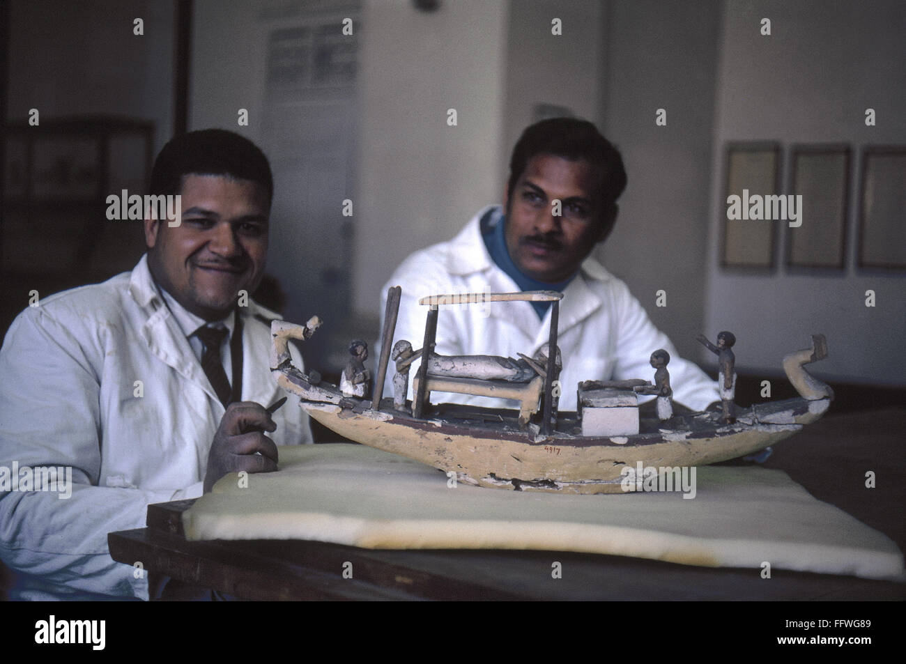 EGYPT: FUNERARY BOAT. /nEgyptian archaeologists restoring a model ...