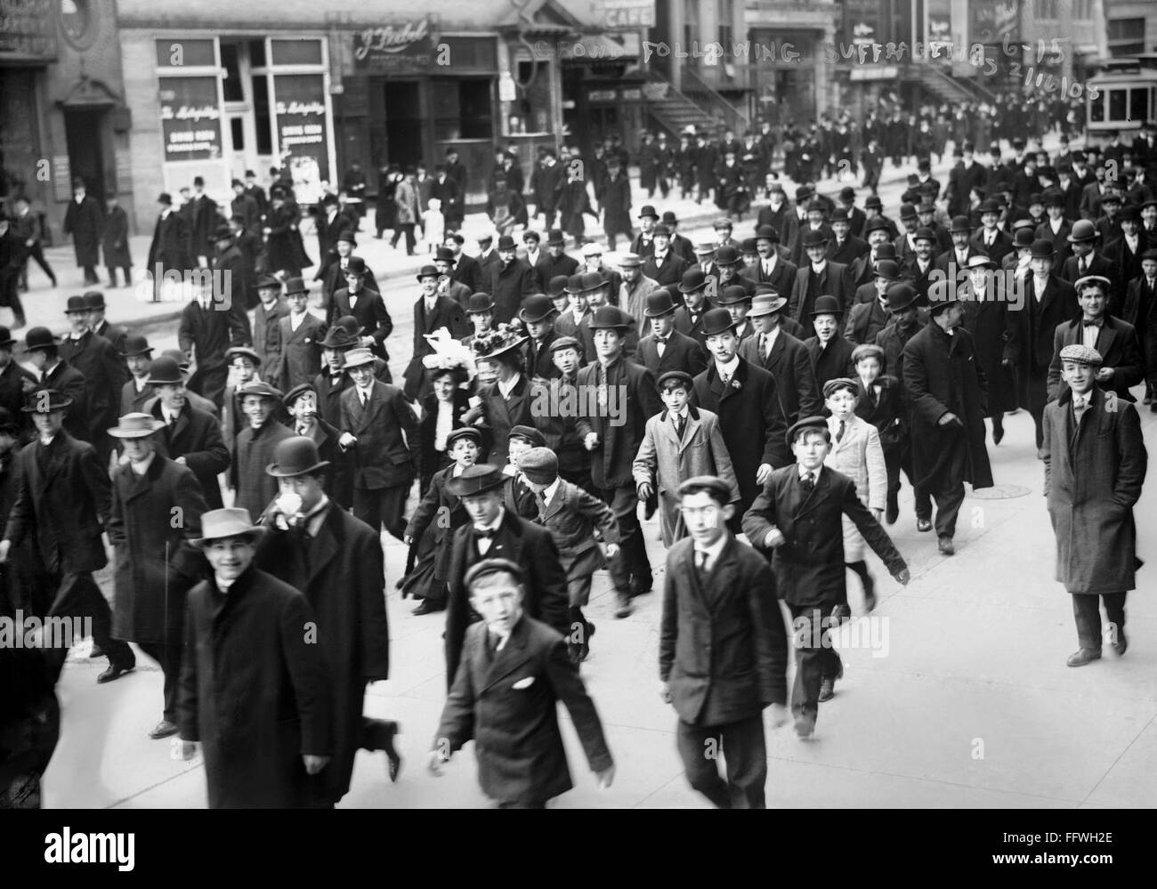 NEW YORK: SUFFRAGETTES. /nA crowd of onlookers following a suffragette ...