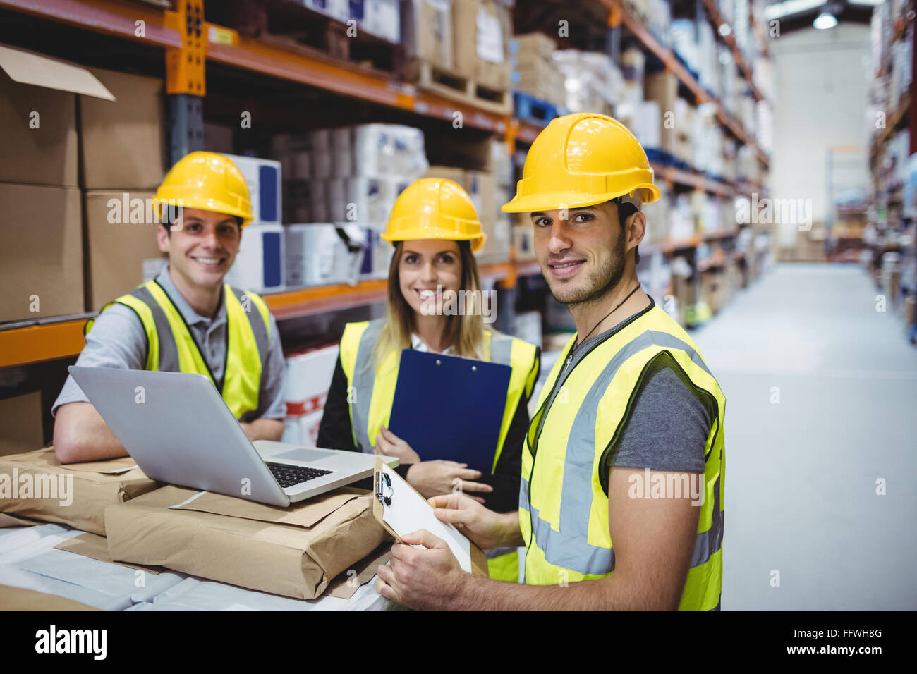 Portrait of smiling warehouse managers Stock Photo - Alamy