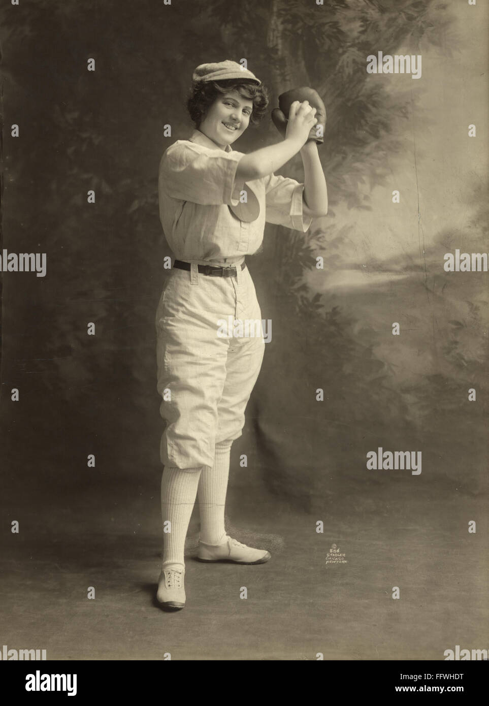 FEMALE BASEBALL PLAYER. /nA female baseball player, in uniform, in a ...
