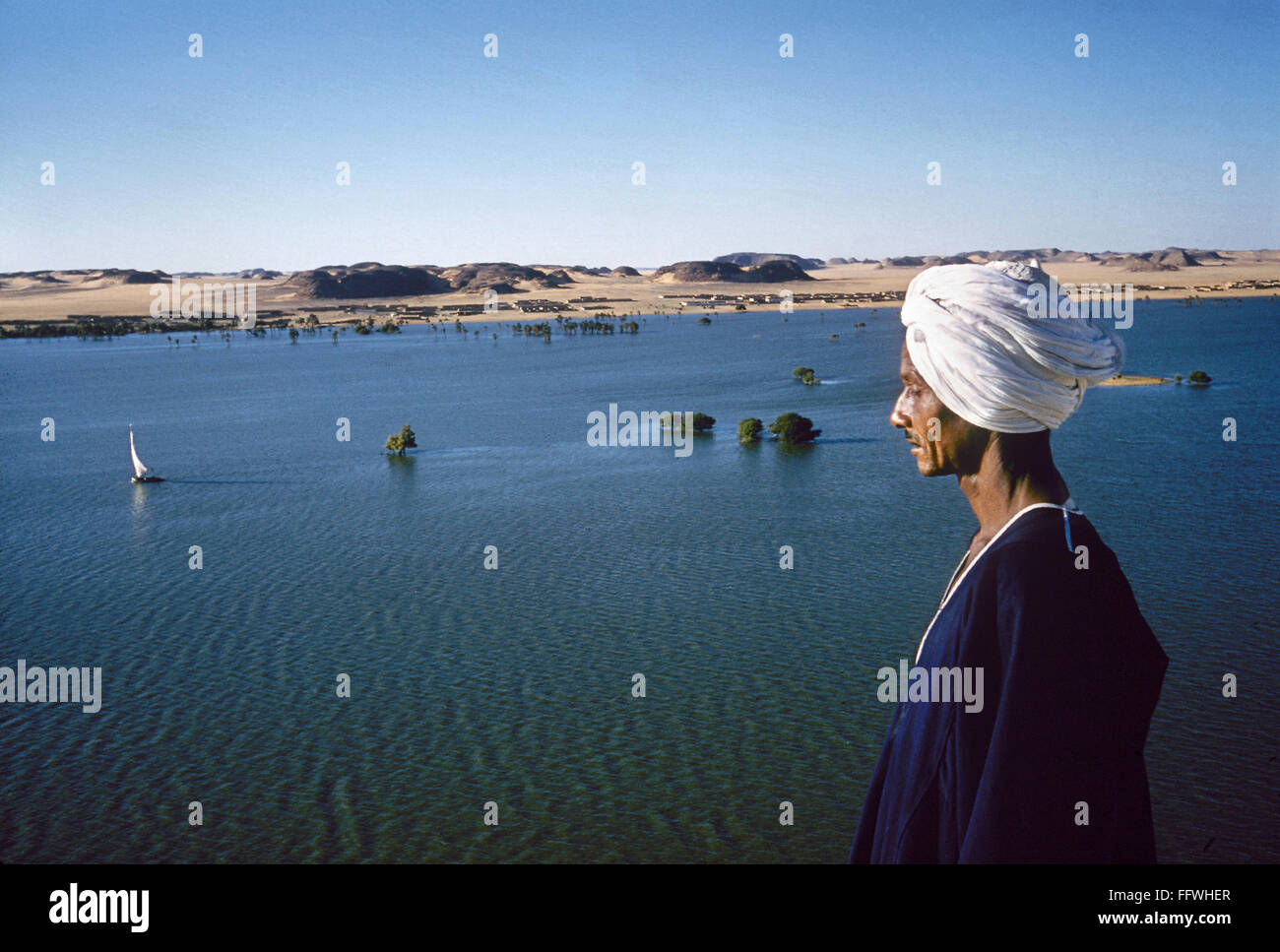 EGYPT: NILE SCENE. /nA man standing beside a flooded expanse of the ...