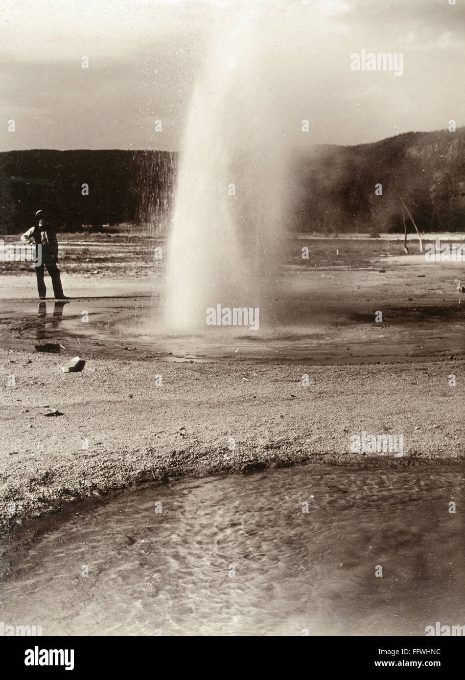 YELLOWSTONE PARK: GEYSER. /nSpectator watching Economic geyser eruption ...