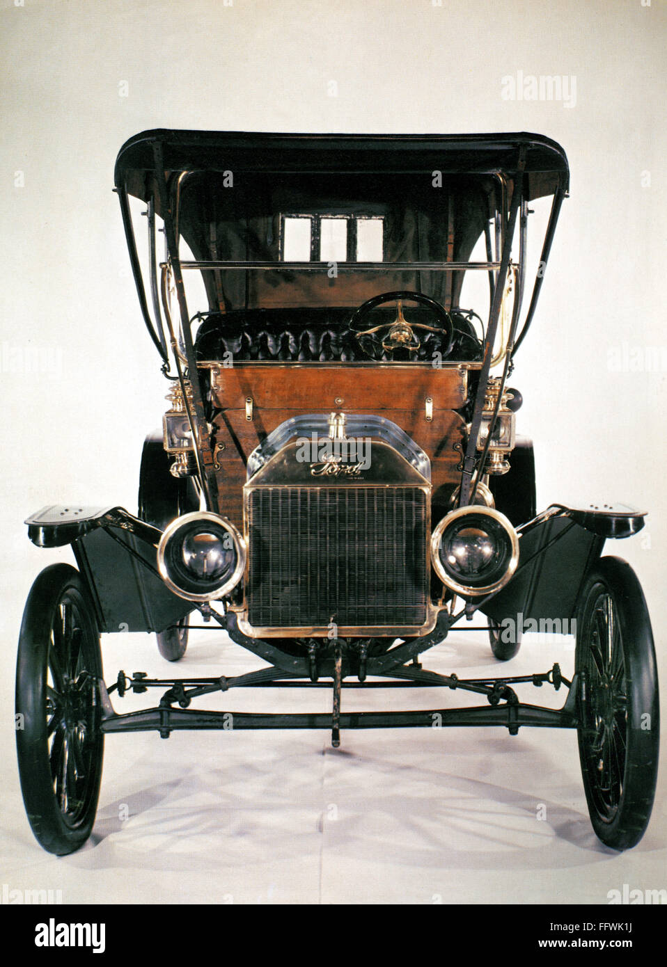 MODEL T FORD, 1910. /nModel T Ford with brass radiator, head lamps and ...
