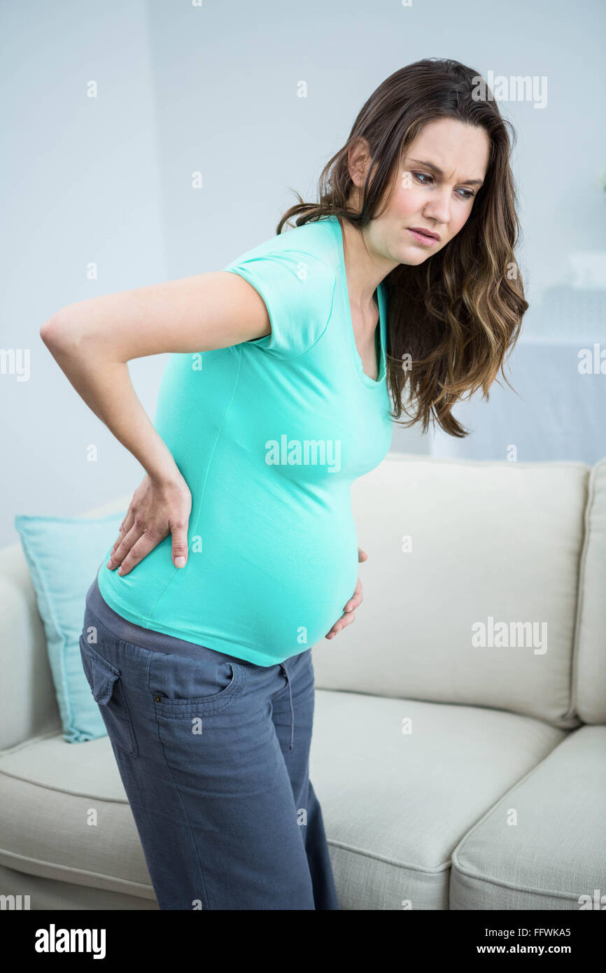 Pregnant woman with back pain Stock Photo - Alamy