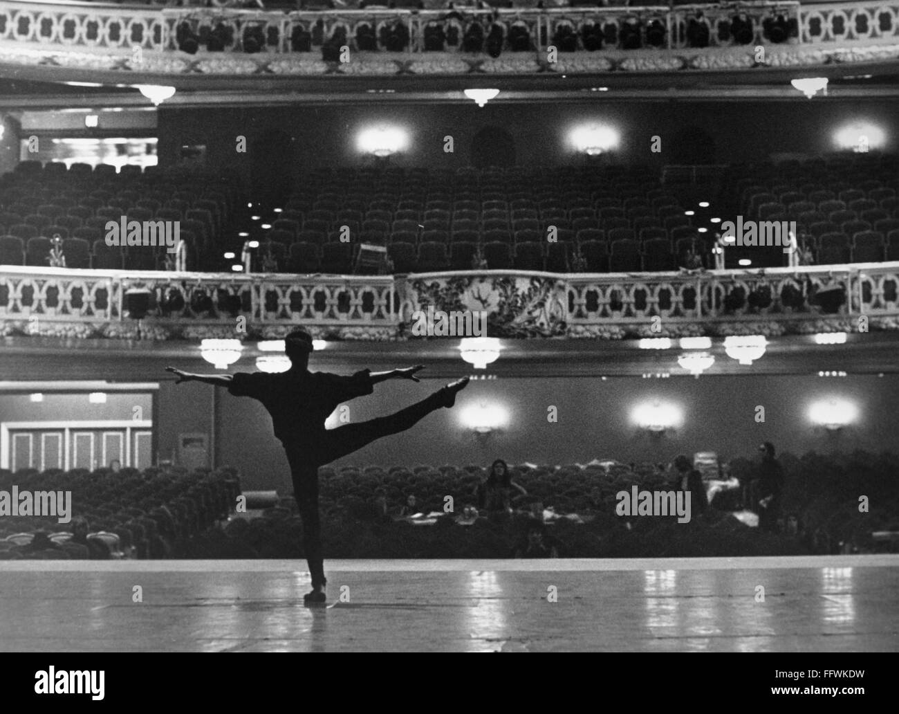 DANCE AUDITION, 1974. /nA dancer auditioning on the stage of the ...