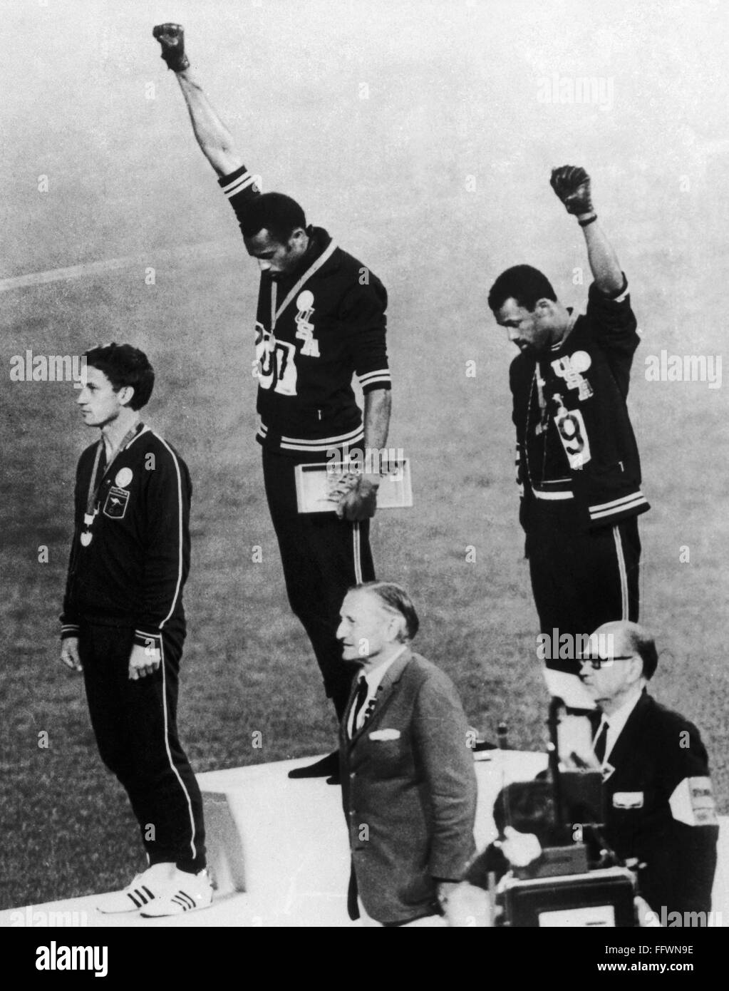 OLYMPIC GAMES, 1968. /nAmerican runners Tommie Smith (center) and John ...