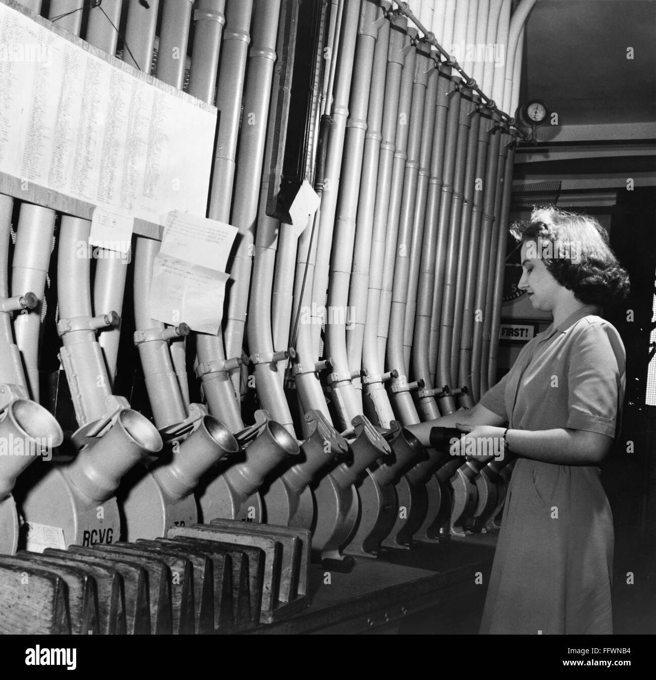PNEUMATIC TUBES, 1943. /nA woman delivers messages to different ...