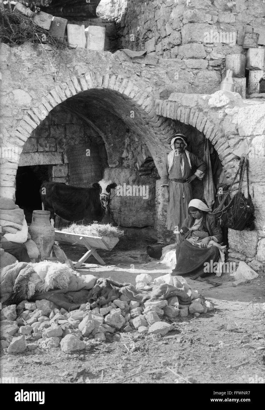 BETHLEHEM: HOME, c1928. /nA family outside a stone home in Bethlehem ...