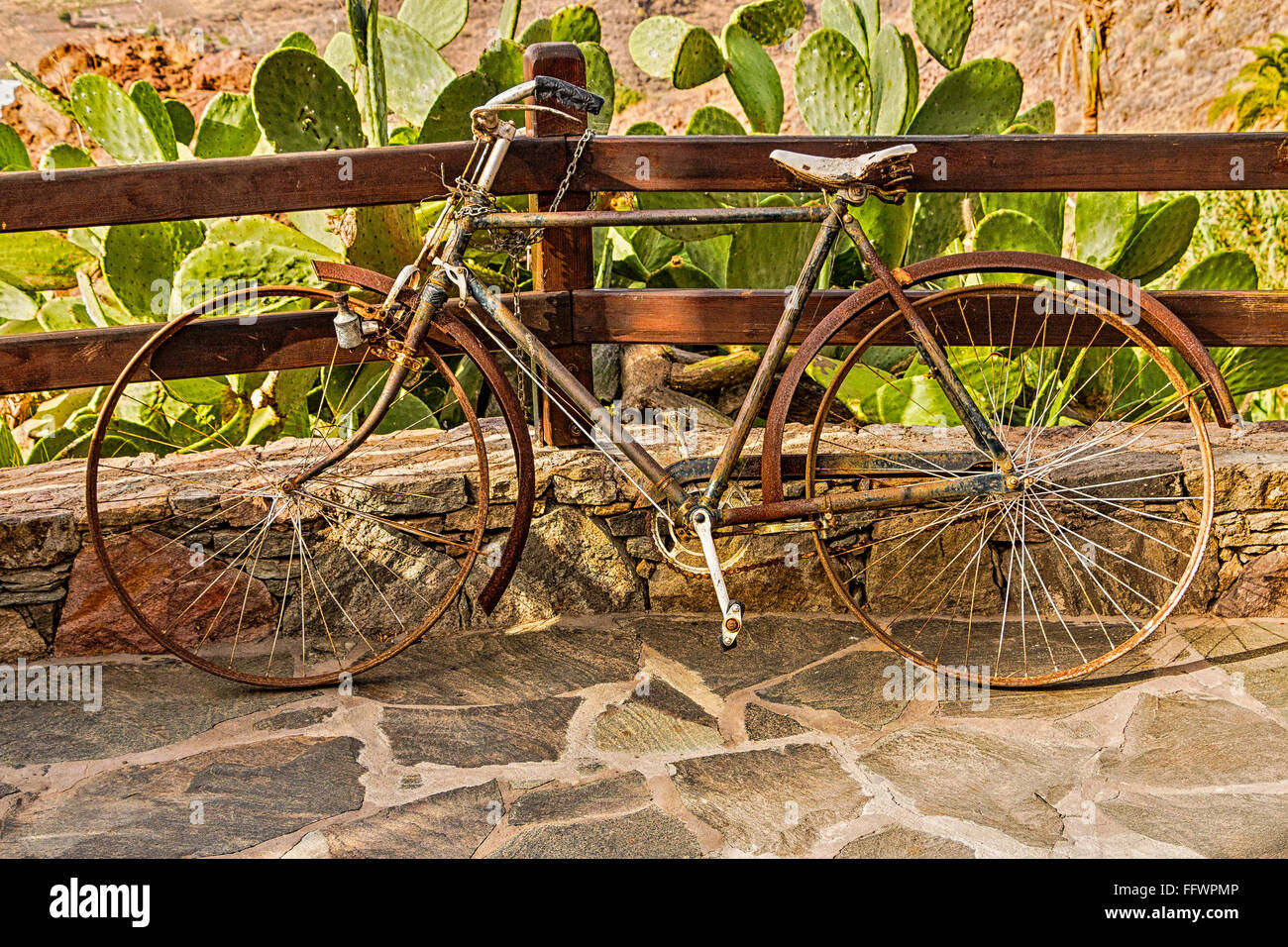 Bike leaning against fence hi-res stock photography and images - Alamy