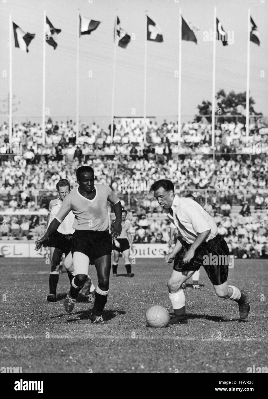 WORLD CUP, 1954. /nVictor Rodriguez Andrade of Uruguay (left) and ...